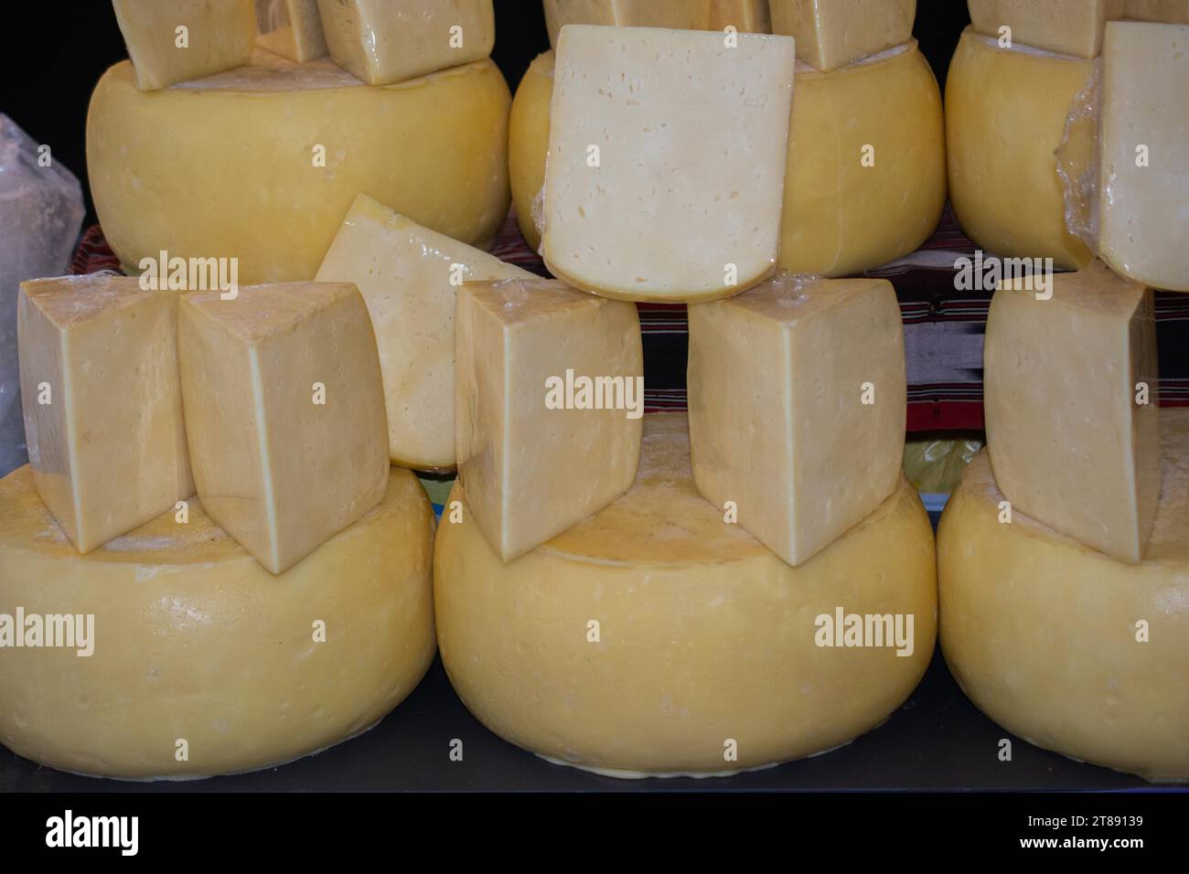 Cuts of kashkaval or kasseri cheese for sale on the shelf Stock Photo ...