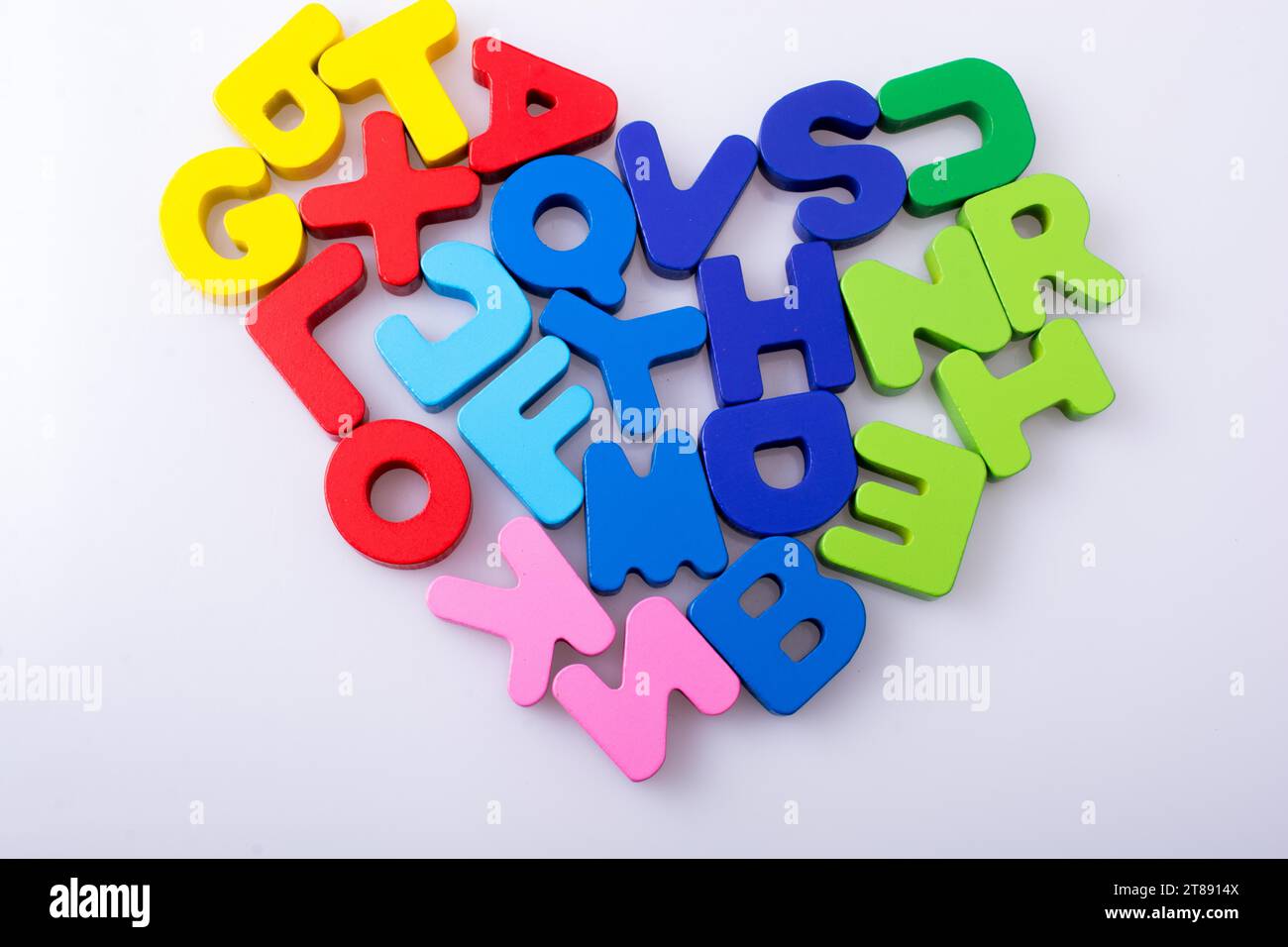 Colorful letter blocks shape heart on white background Stock Photo - Alamy