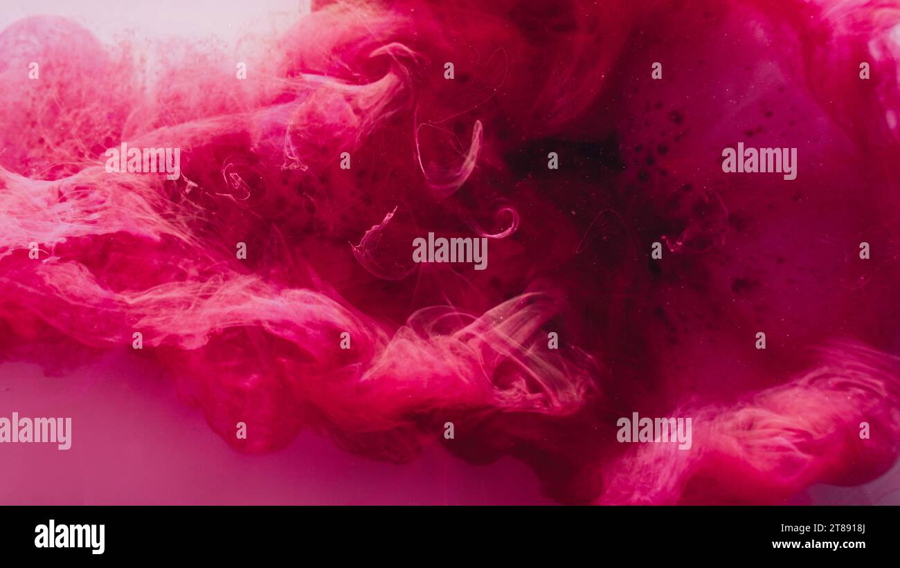 Ink splash background pink puff cloud spreading Stock Photo - Alamy