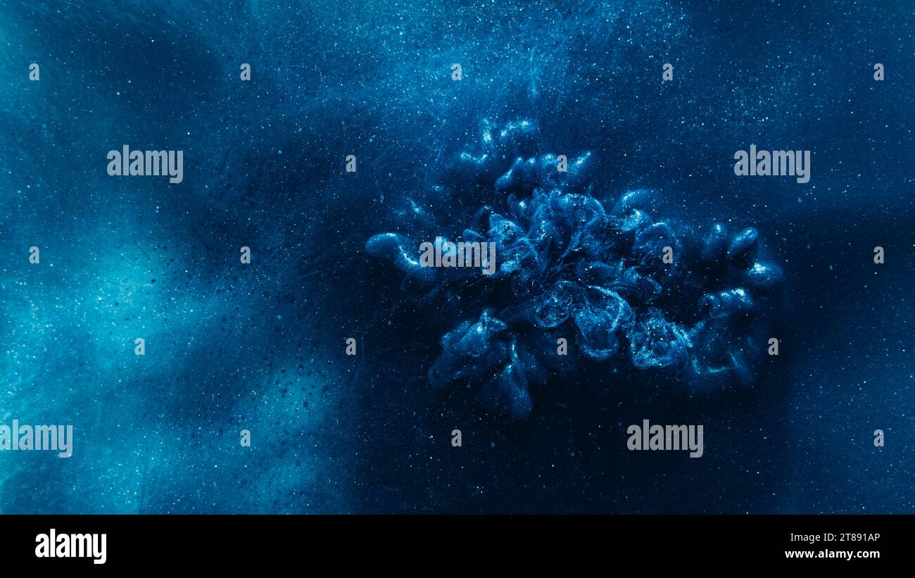 Ink explosion background blue smoke dark glitter Stock Photo - Alamy