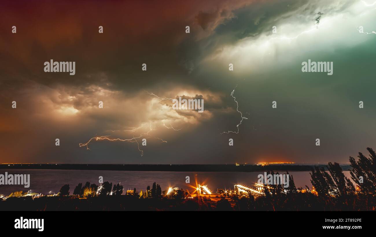 Night thunder in the sky above the river Stock Photo - Alamy