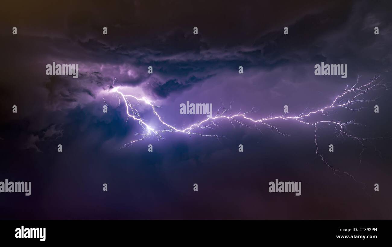Bright flash of lightning in the night sky Stock Photo - Alamy