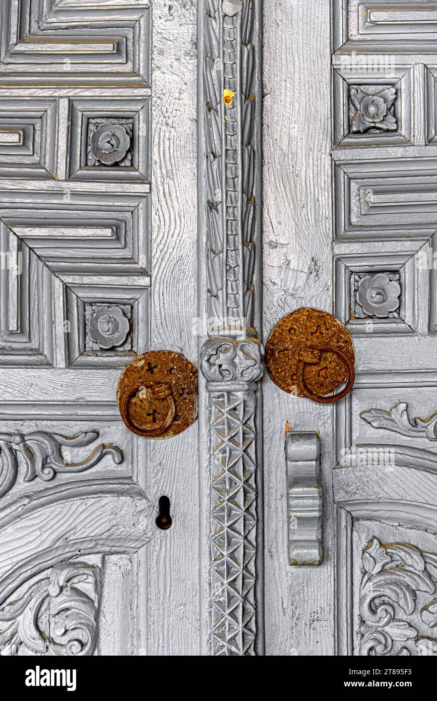 Antique gray wooden door with iron handles. Holy Cross Monastery In ...