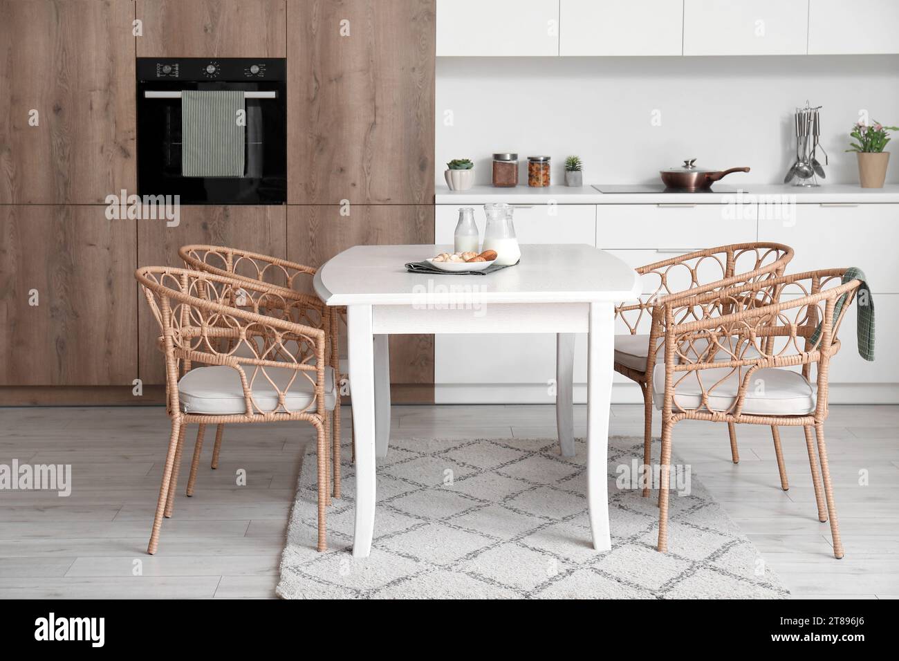 Interior of modern kitchen with milk and pastry on dining table Stock ...