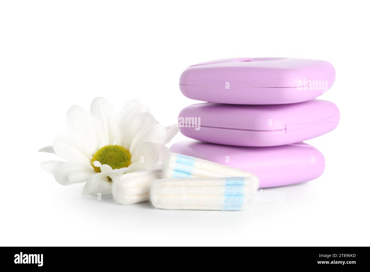 Menstrual tampons, storage boxes and chamomile flower on white ...