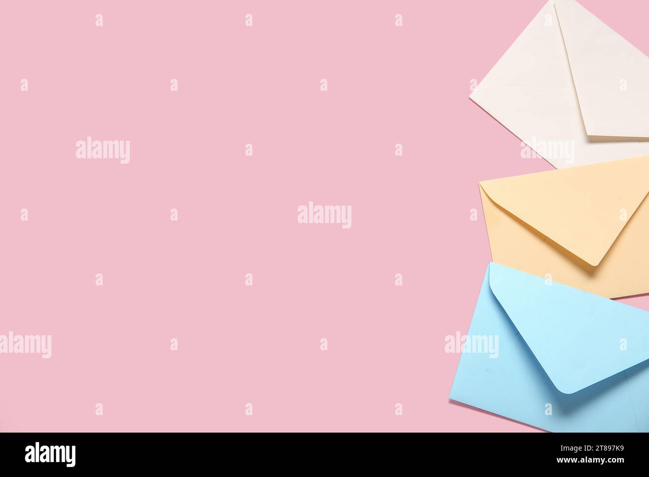 Closed envelopes on pink background Stock Photo - Alamy