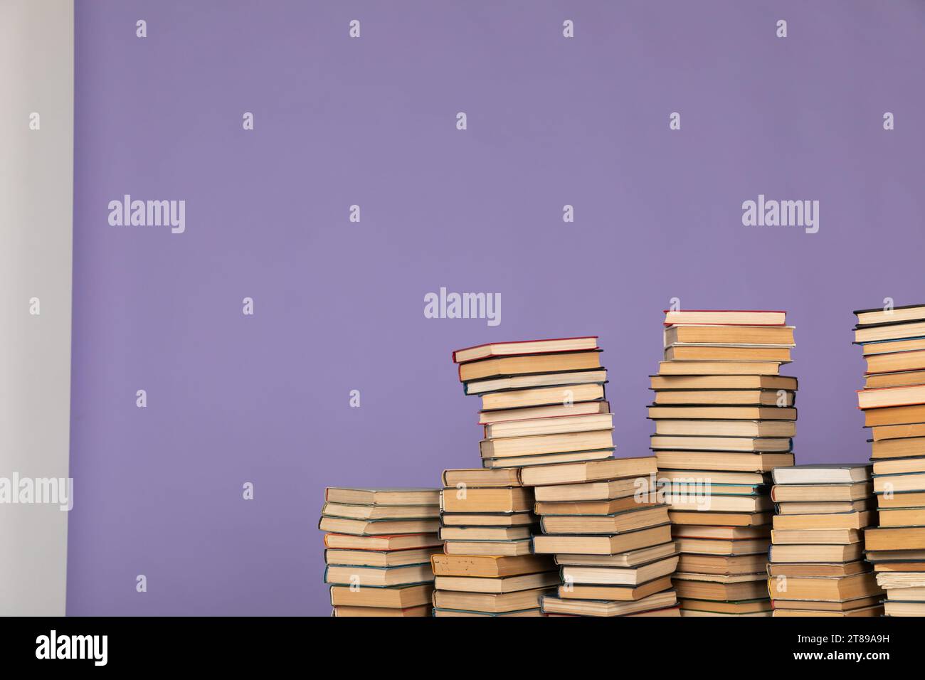 large stacks of books in the library of knowledge science literature ...