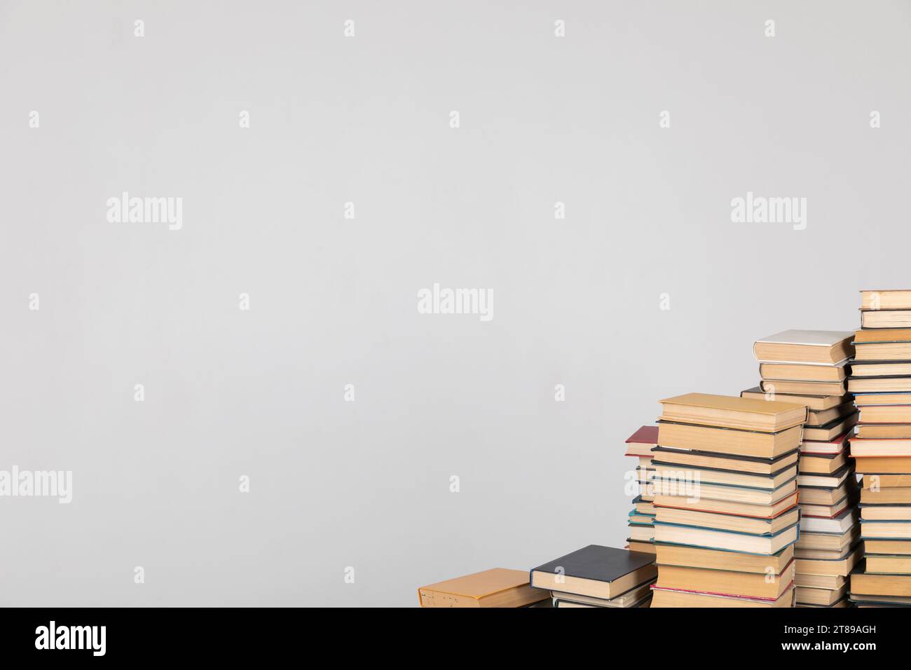 many books stacked on a white background in the library of science ...
