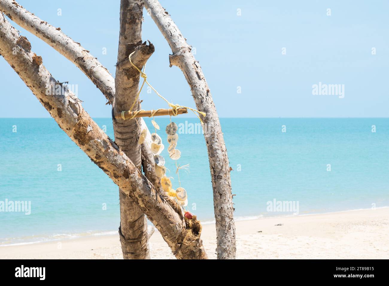Wooden sticks and artwork on beach in Thailand Stock Photo - Alamy