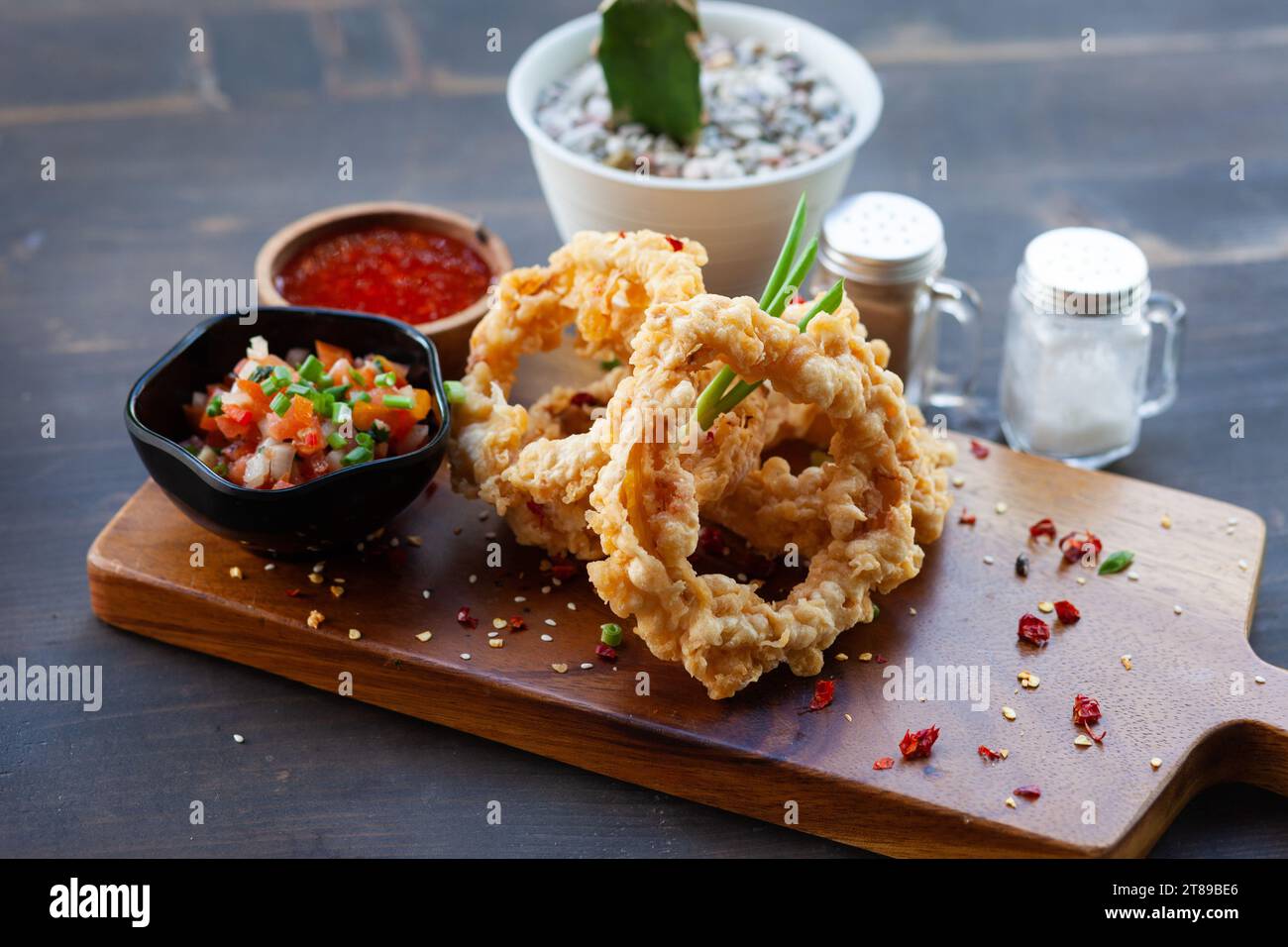 Large onion rings Mexican-style with salsa and sauce Stock Photo - Alamy