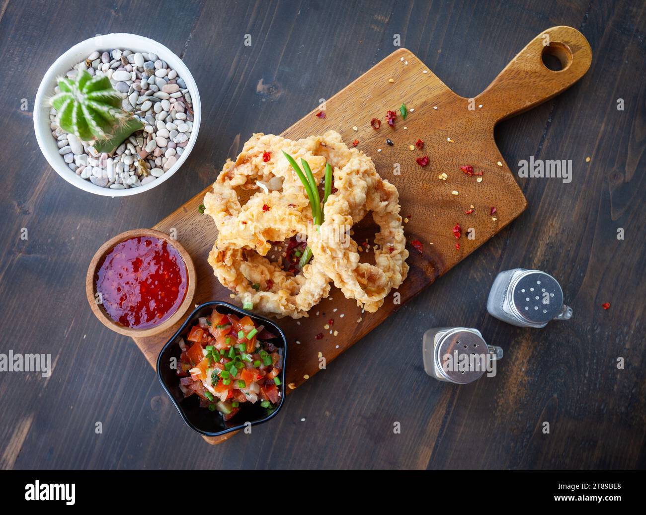 Large onion rings Mexican-style with salsa and sauce Stock Photo - Alamy