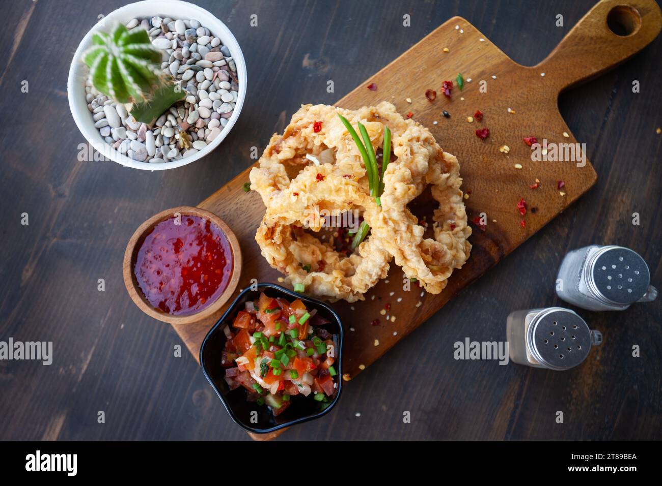 Large onion rings Mexican-style with salsa and sauce Stock Photo - Alamy