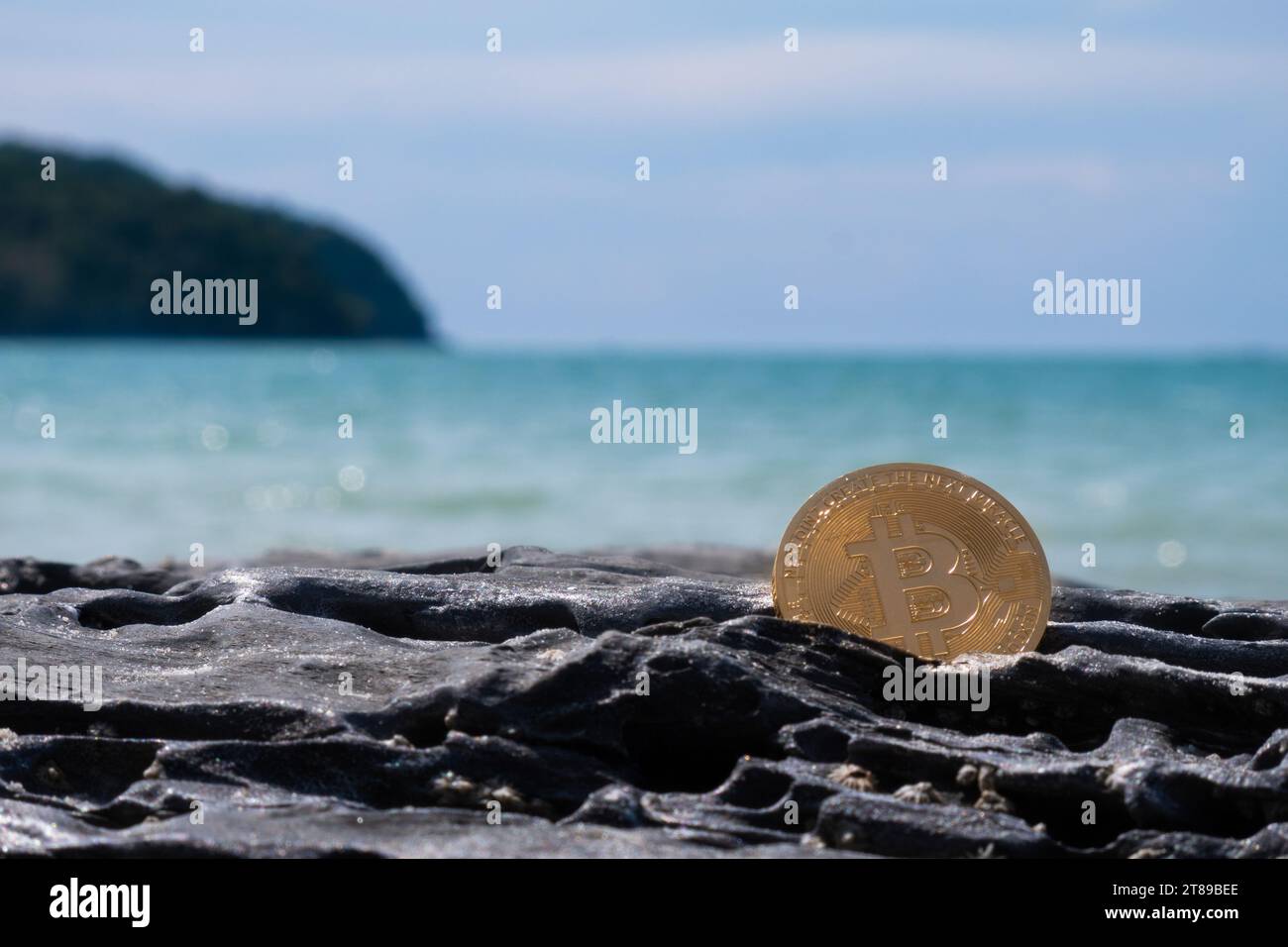 Bitcoin coin on a beach in Malaysia Stock Photo - Alamy