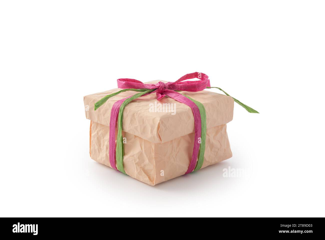 Front view of peach color gift box with purple-green paper ribbon bow ...