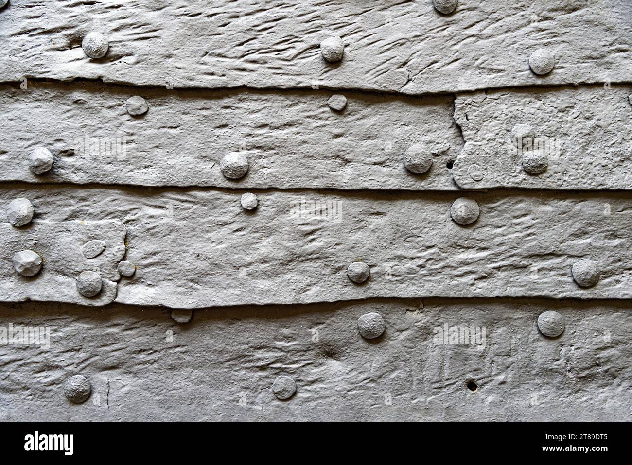 Wrought iron sheet surface with metal rivets Stock Photo - Alamy