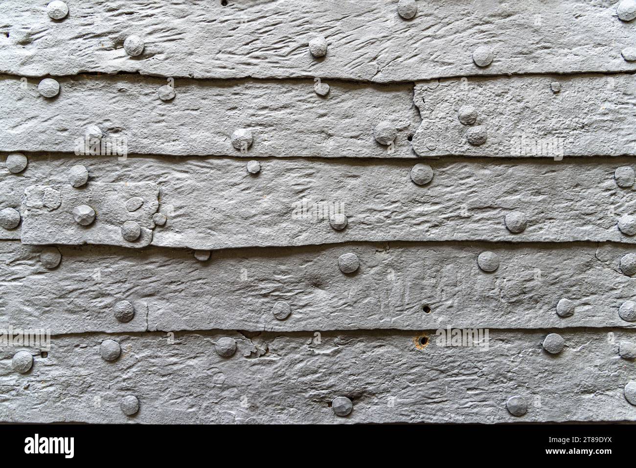 Wrought iron sheet surface with metal rivets Stock Photo - Alamy