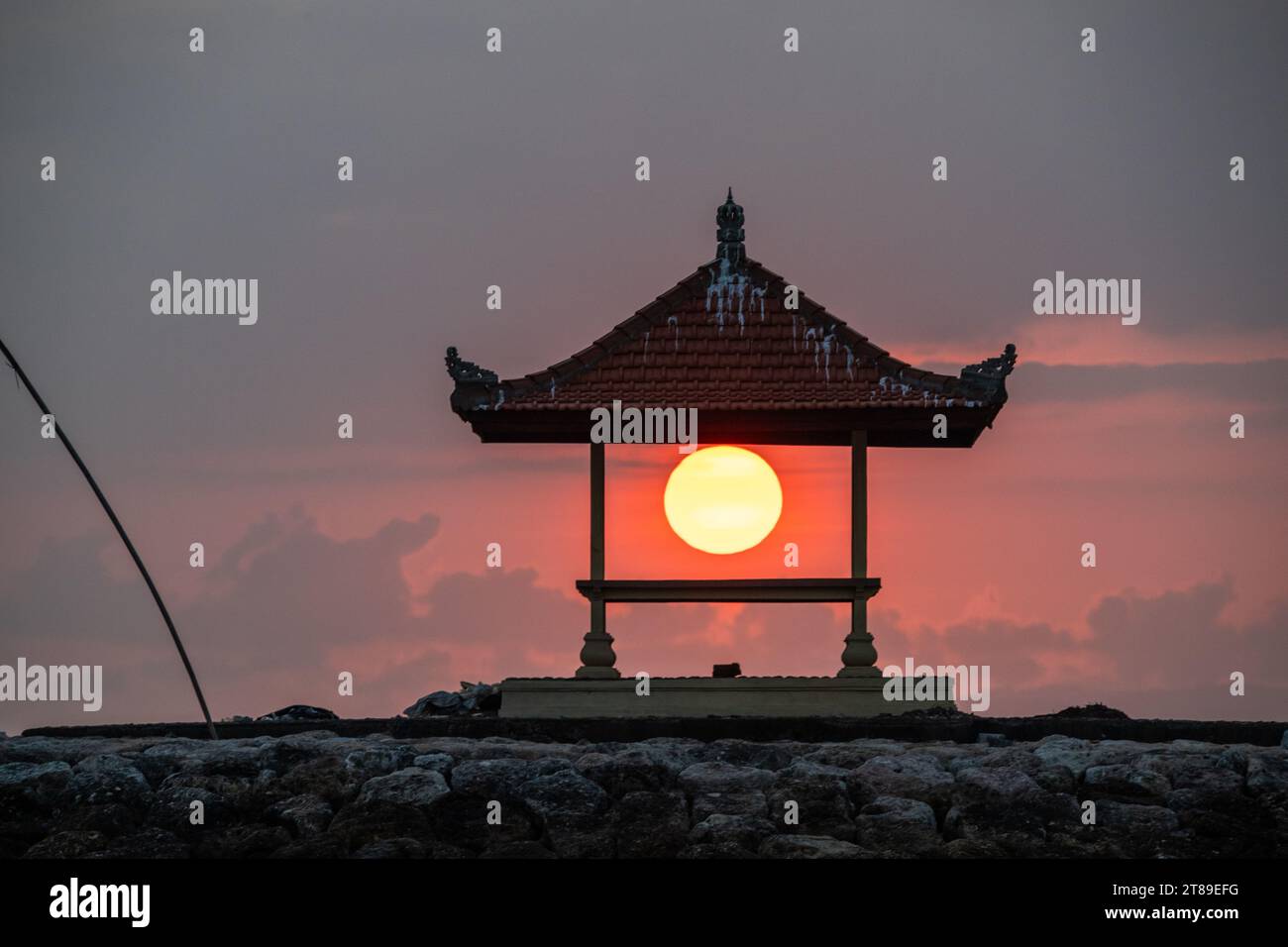 Great sun ball in a small temple in Bali, on the sandy beach of Sanur ...
