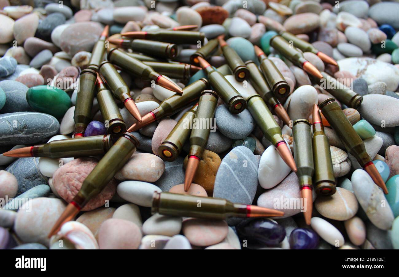Small coastal stones with randomly scattered live ammunition Stock ...