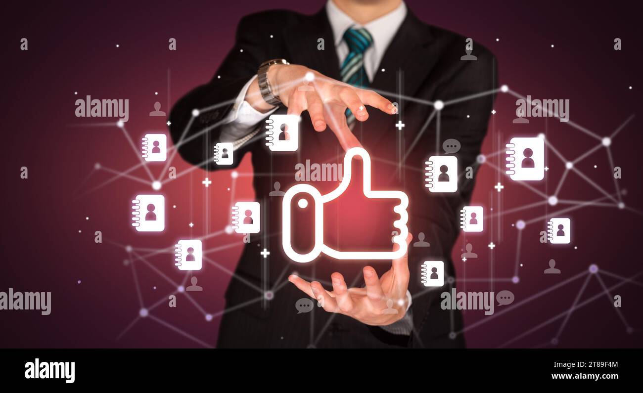 Hand holding social media icons Stock Photo - Alamy