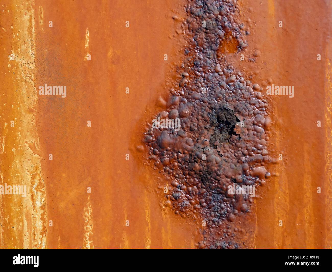 Metal surface with an orange coating that rusts with age Stock Photo ...