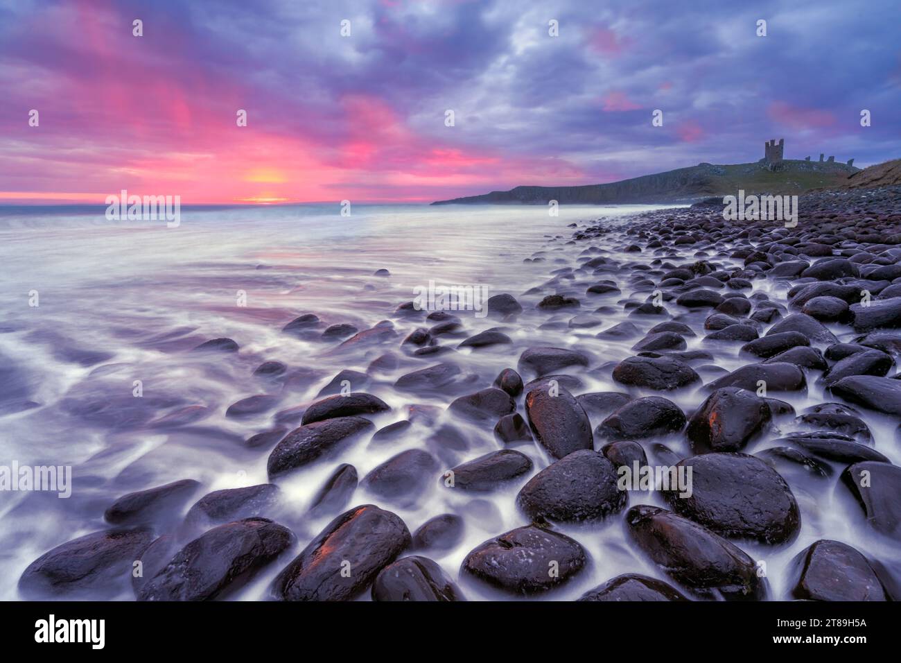 Dunstanburgh Castle beach Stock Photo - Alamy