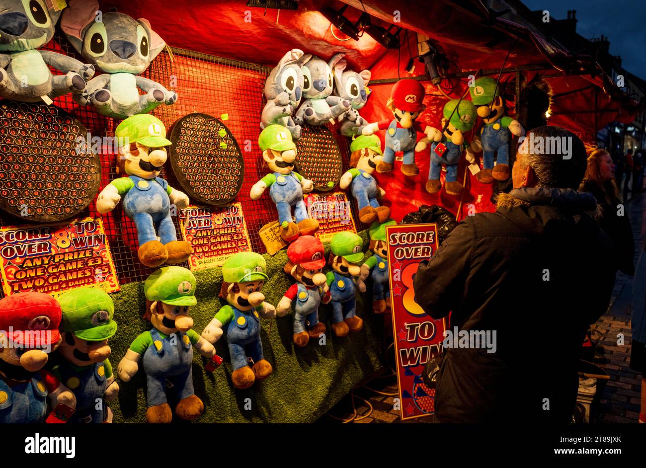 Colourful stall at a Christmas street market and fun fare in Lanark ...