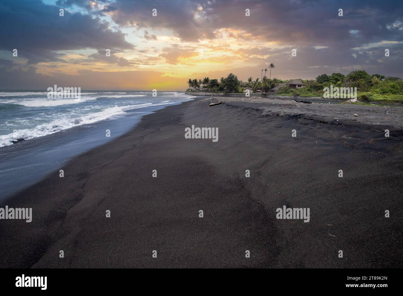 Black sand beach in Bali, natural with temples, boats (jukung) and ...