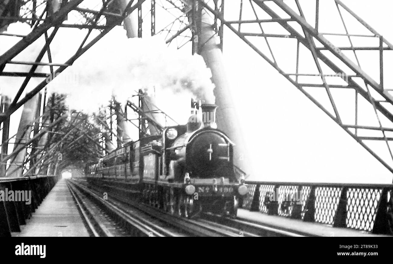 Steam train crossing the Forth Bridge, early 1900s Stock Photo - Alamy