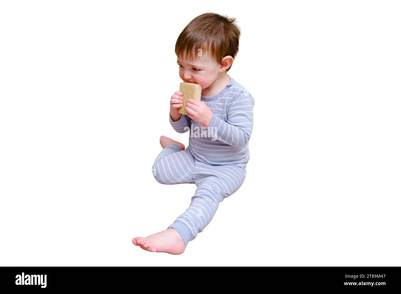 Toddler baby plays with household chemicals and detergent from the ...