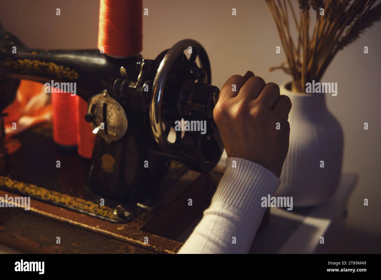 Hand sewing woman on busy hi-res stock photography and images - Alamy