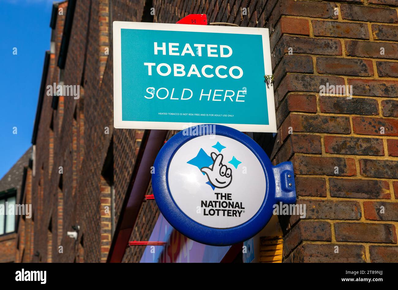Wall signs advertising Heated Tobacco Sold here and the National ...