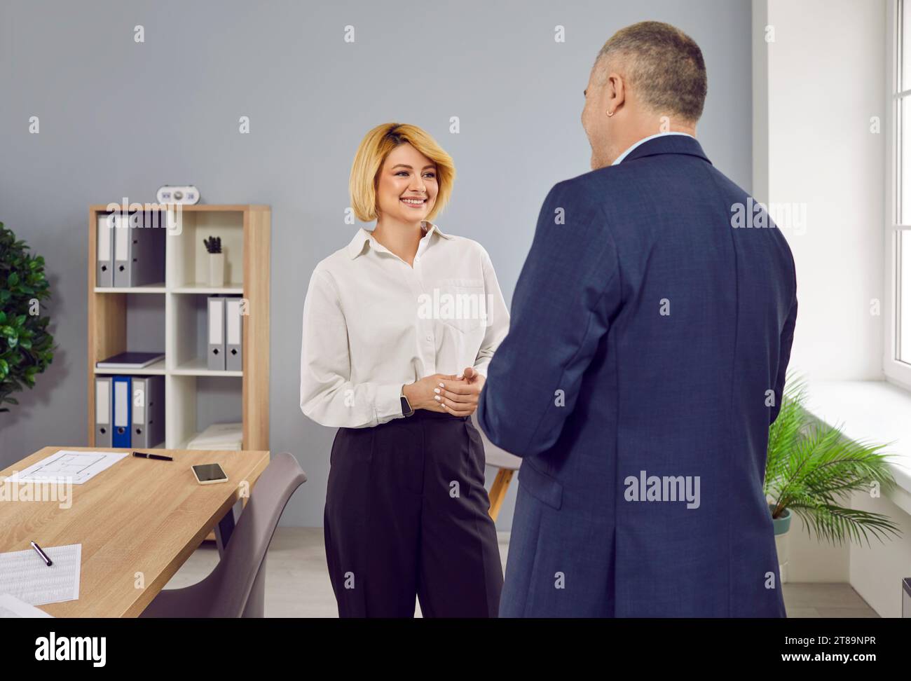 Business man woman talking standing hi-res stock photography and images ...