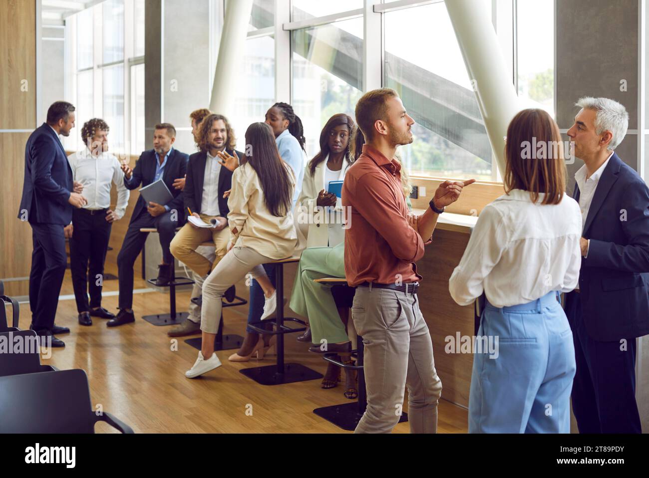 Group of diverse business people chatting after meeting standing in ...