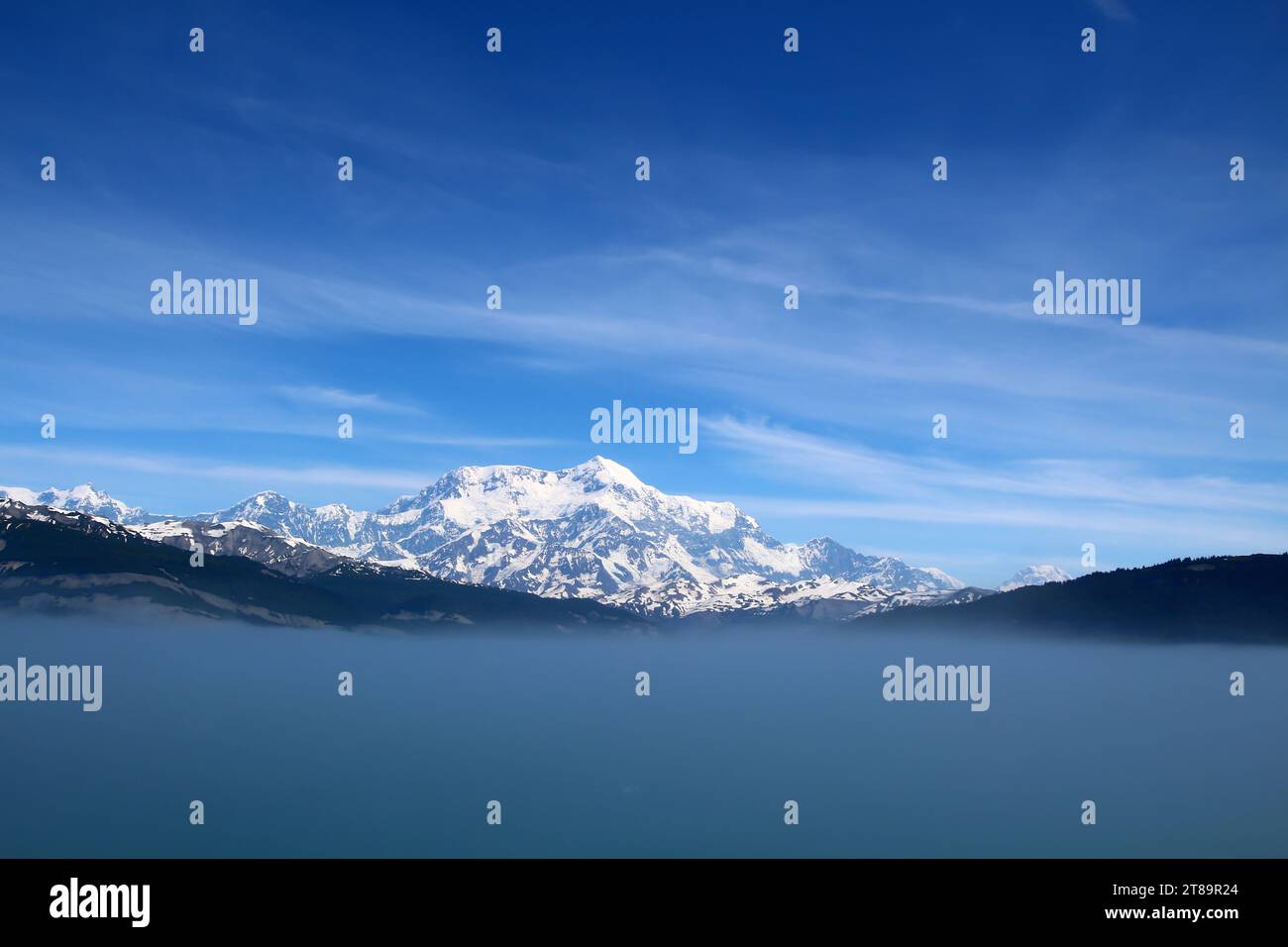 Alaska-Mount Saint Elias rising from a fog bank seen from Icy Bay, it ...