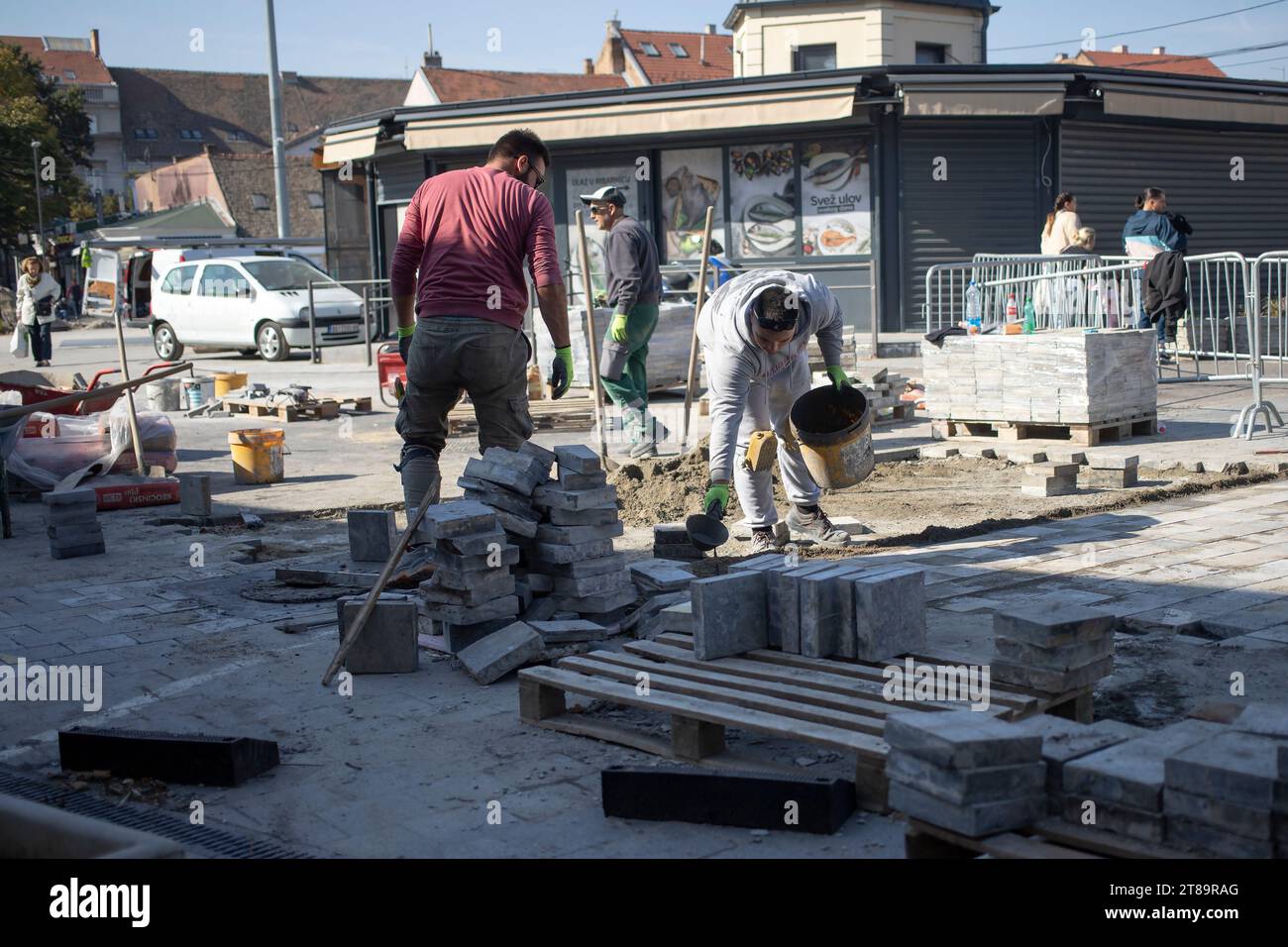 Belgrade, Serbia, Oct 18, 2023: Construction workers paving the plateau ...