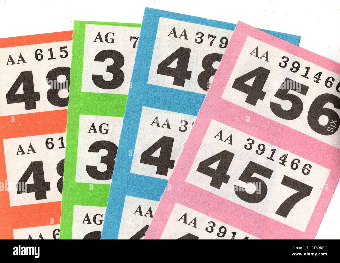 A fan of coloured vintage raffle tickets on a white background Stock ...