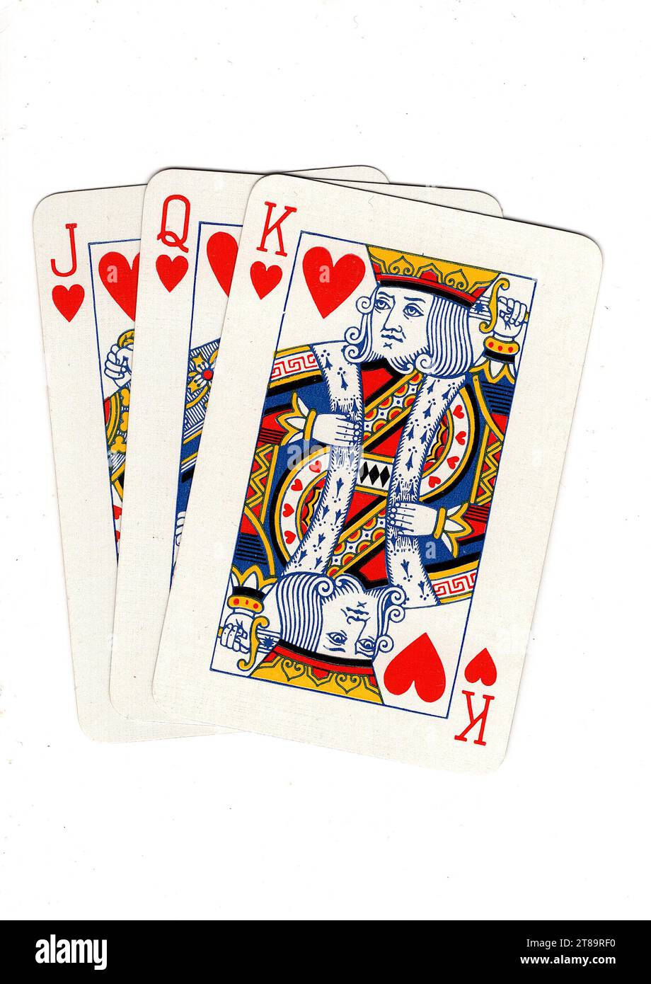 Antique playing cards showing a three card run of jack, queen and king ...