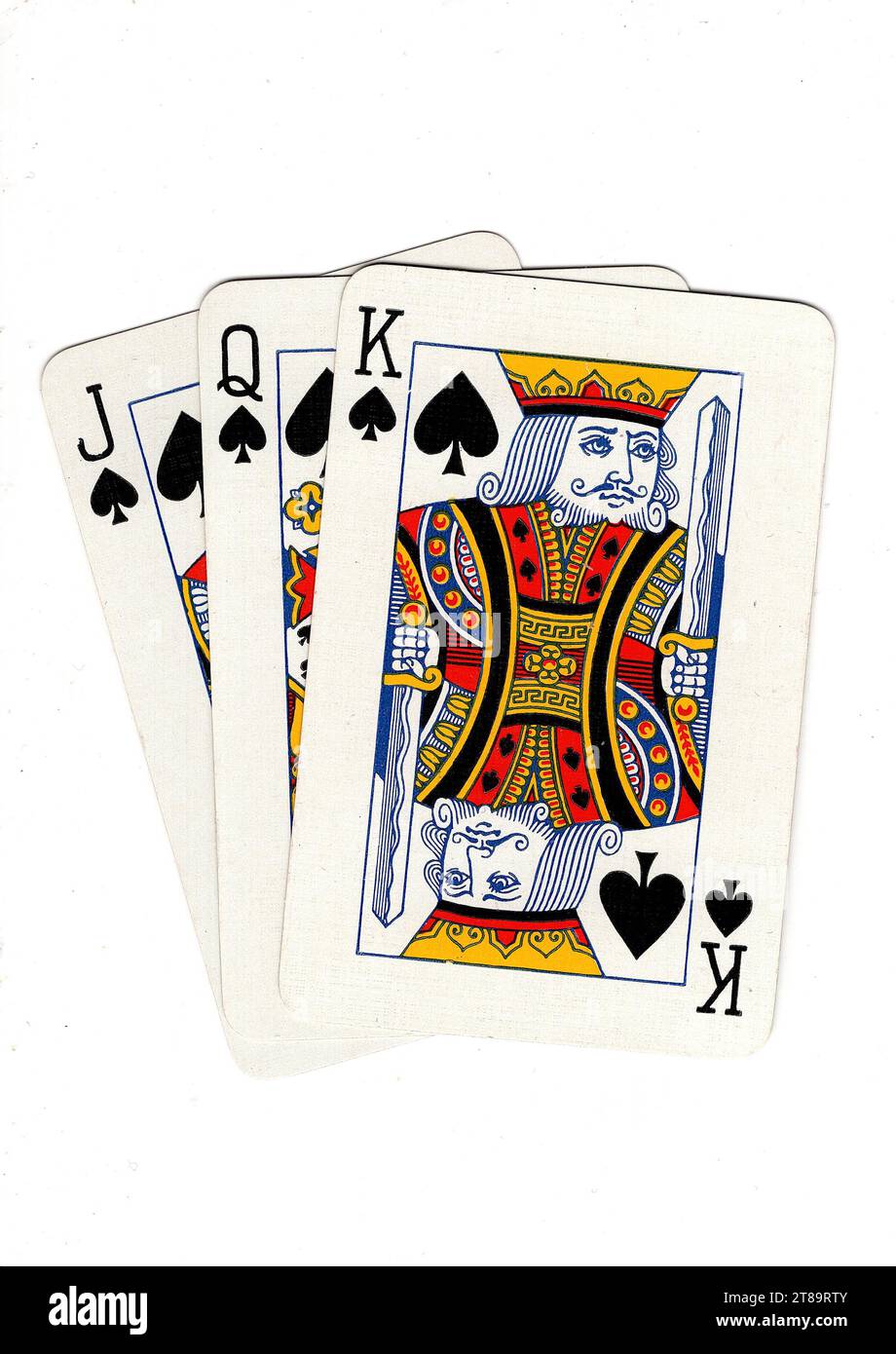 Antique playing cards showing a three card run of jack, queen and king ...