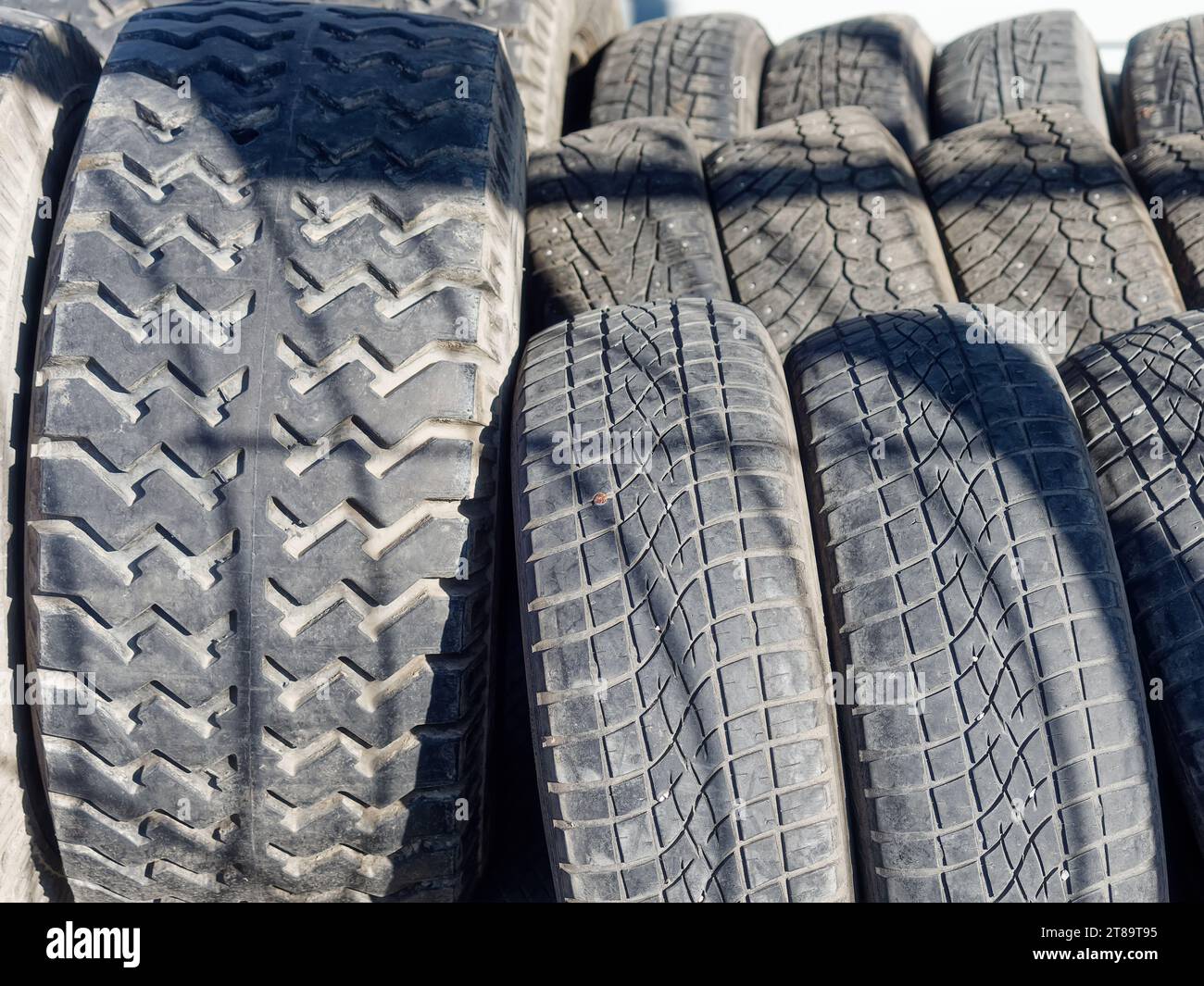 Used car tires. Rubber wheel tires. Recycling of old worn-out truck ...