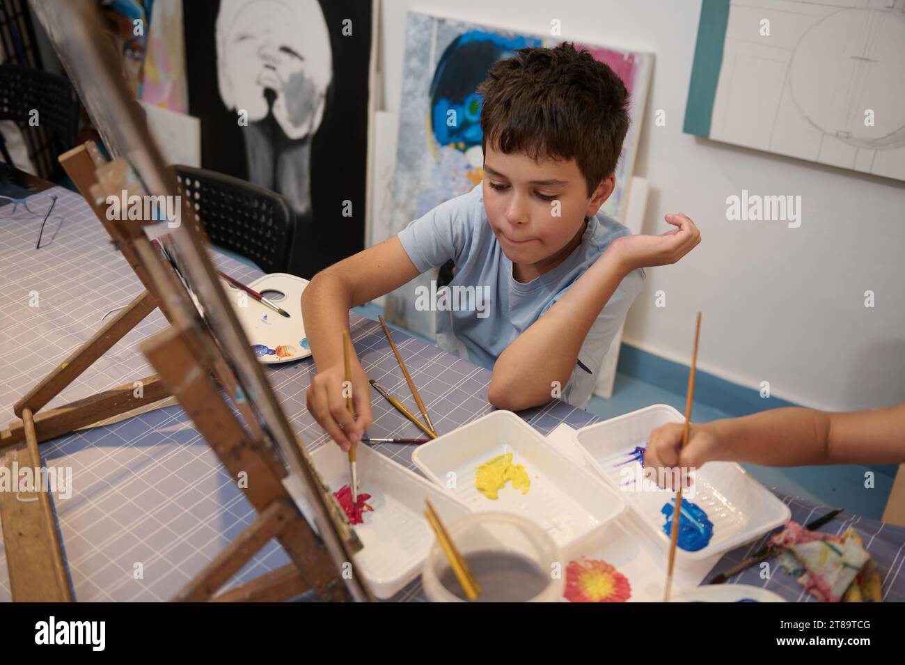 Authentic confident happy teenage boy, elementary age school student is ...