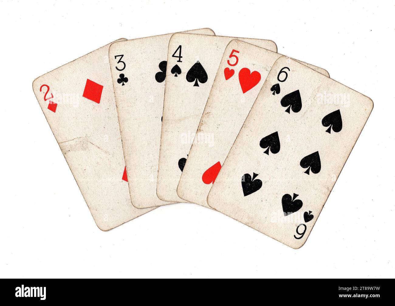 A poker hand of vintage playing cards showing a straight on a white ...