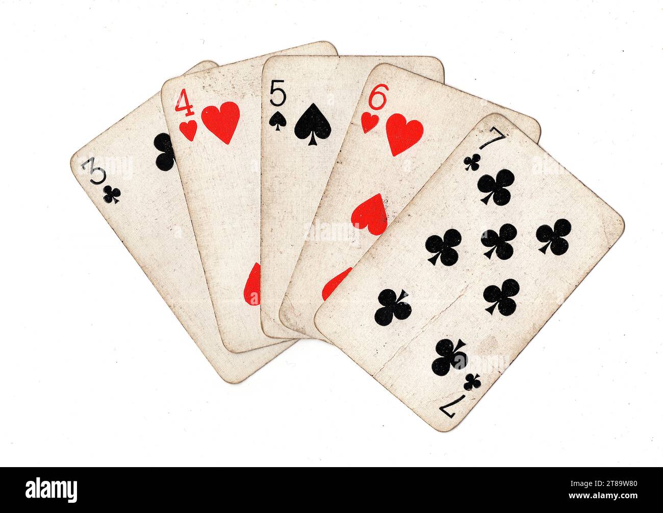 A poker hand of vintage playing cards showing a straight on a white ...