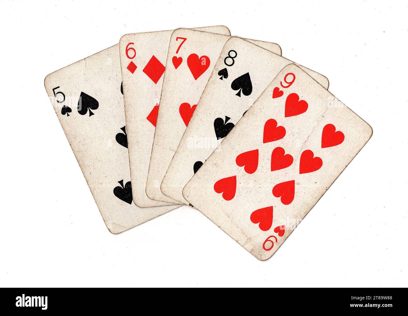 A poker hand of vintage playing cards showing a straight on a white ...