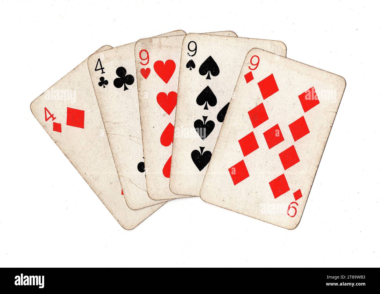 A poker hand of vintage playing cards showing a full house of nines and ...