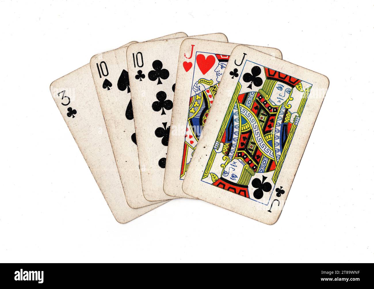 A poker hand of vintage playing cards showing two pairs of jacks and ...