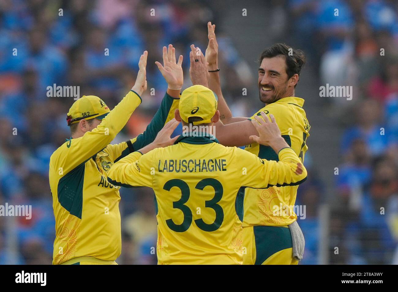 Australia's Mitchell Starc, right, Steve Smith, left, and Marnus ...