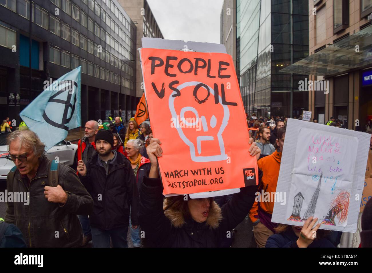 London, UK. 18th November 2023. Just Stop Oil activists march near ...