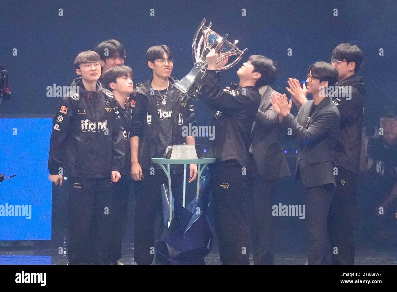 Members of team T1 celebrate with winners' trophy after winning the ...
