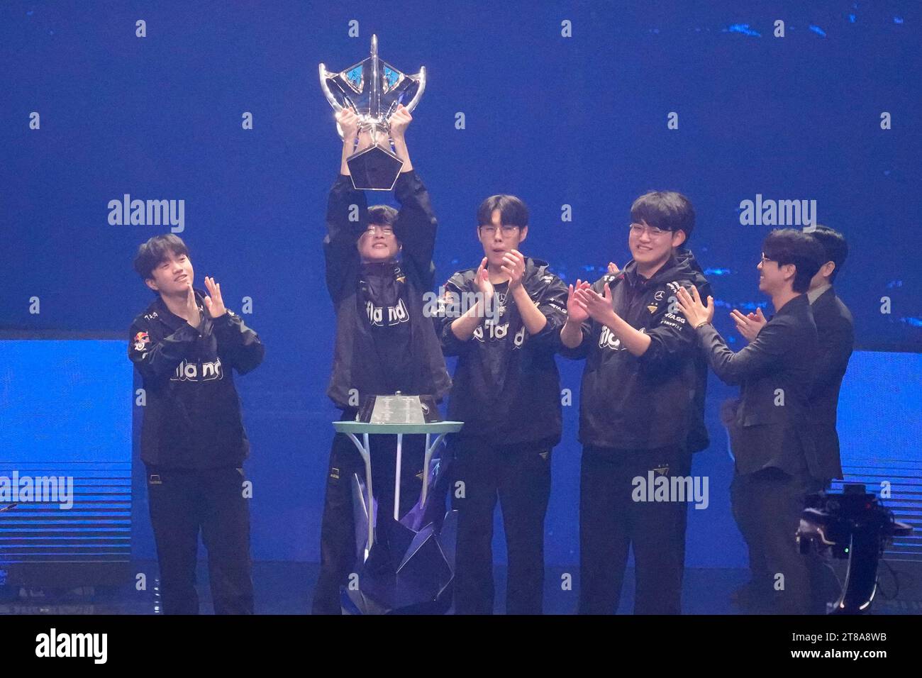 Members of team T1 celebrate with winners' trophy after winning the ...