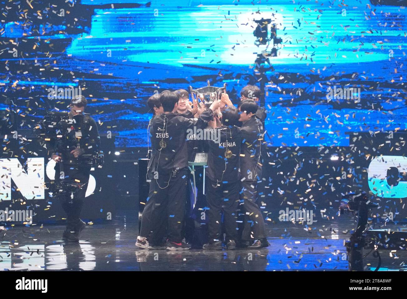 Members of team T1 celebrate with winners' trophy after winning the ...